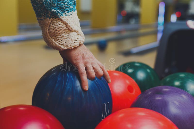 Male Hand Taking Ball from Bowling Machine Stock Photo - Image of ...