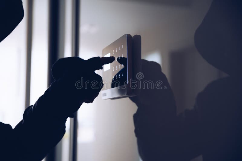 The Male Hand of a Thief Pressing the Code for a Home Alarm Stock Photo ...