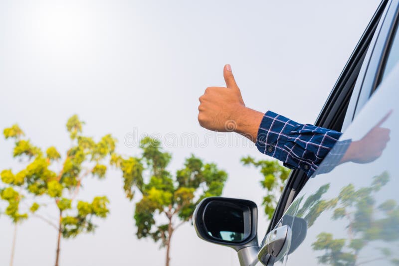 Male hand thumbs up in car stock image. Image of automobile - 151924609