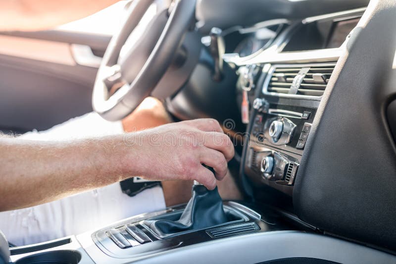 Male Hand on Transmission Gear Inside Car. Close View of Male Hand with ...
