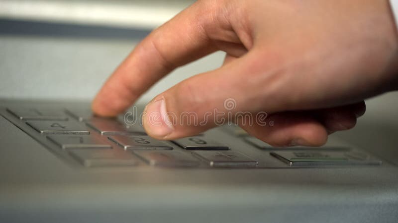 Male Hand Using ATM, Inserting Unique Personal Code and Pressing ...