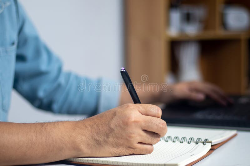 Male Hand Writing a Note in a Notebook Concept of Business People ...