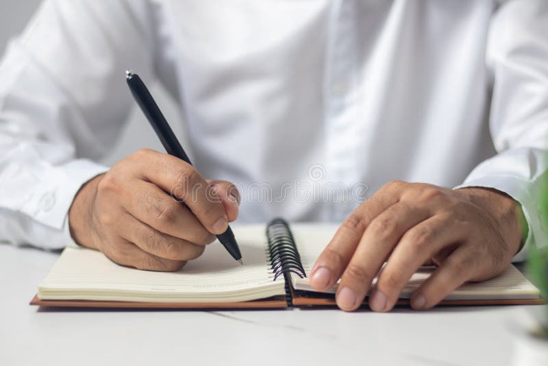 Male Hand Writing a Note in a Notebook Concept of Business People ...