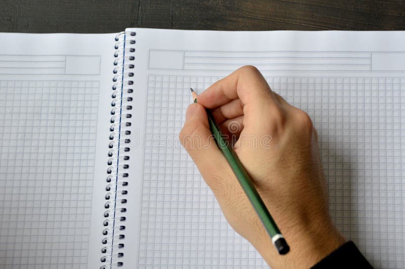 Male Hand Writing on Notebook Stock Photo - Image of homework, desk ...