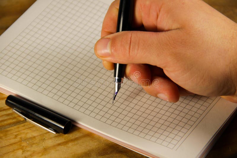 Male Hand Writing Using Fountain Pen on a Notebook Stock Photo - Image ...