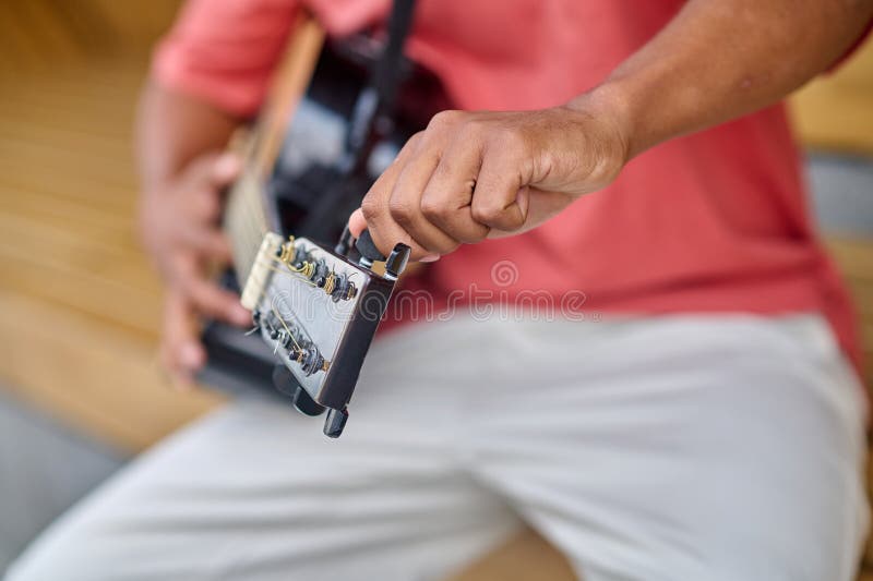 Male Hands Adjusting Guitar Strings Outdoors Stock Image - Image of ...