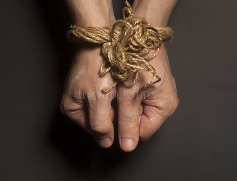 Male hands bound with rope stock image. Image of caught - 106776721
