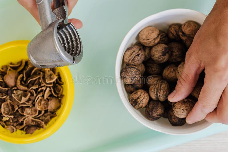 Peeling nuts at home stock image. Image of health, closeup - 276079879