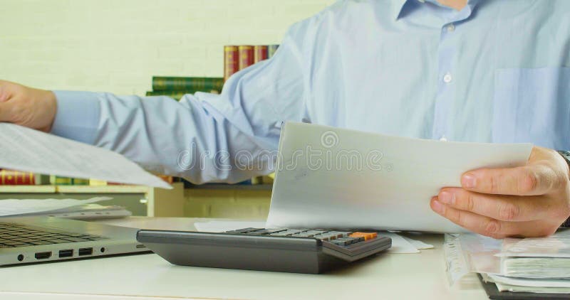 Male Hands with Documents - a Man at the Workplace in the Office Checks ...