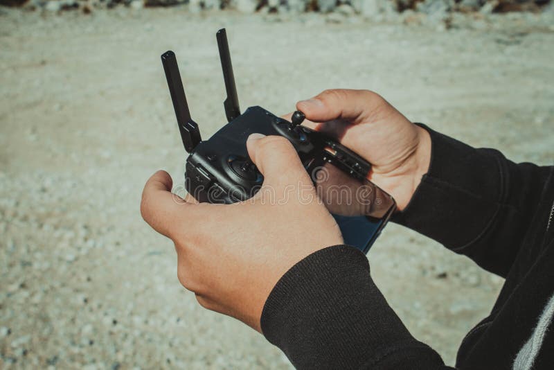 Male Hands Hold Remote Control Panel of Drone for Aerial Photography ...