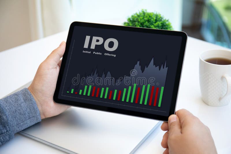 Male Hands Holding Computer Tablet with IPO Stocks Purchase App Stock ...