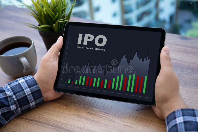 Male Hands Holding Computer Tablet with IPO Stocks Purchase App Stock ...