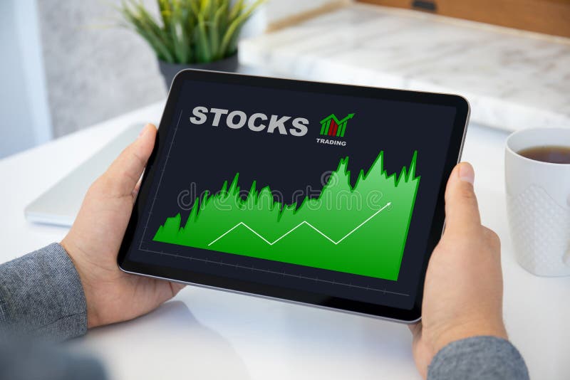 Male Hands Holding Computer Tablet with Stocks Trading App Stock Photo ...