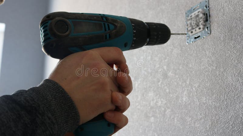 Fixing a Switch To the Wall with a Screwdriver Stock Photo - Image of ...
