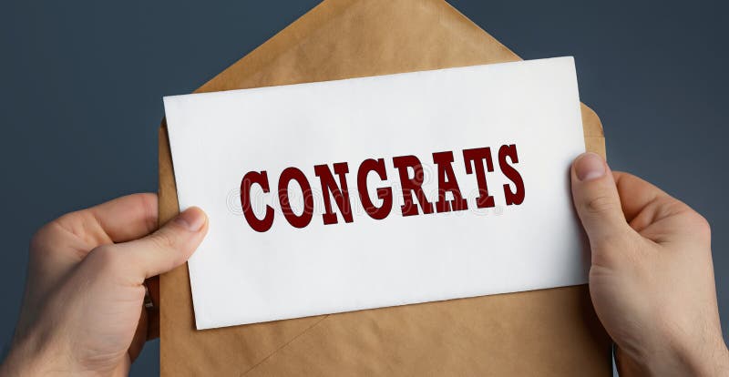 Male Hands Holding Craft Envelope with Word CONGRATS on Blue Background ...