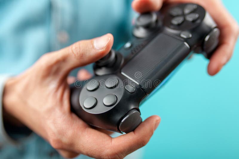 Male Hands Holding A Gaming Controller Stock Image - Image of ... Male Hands Holding A Gaming Controller Stock Image - Image of ...