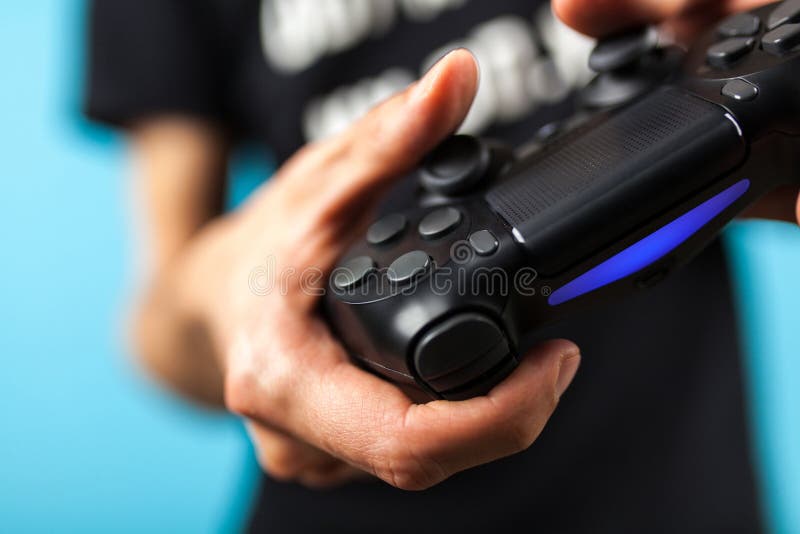 Male Hands Holding a Gaming Controller Stock Photo - Image of ... Male Hands Holding a Gaming Controller Stock Photo - Image of ...