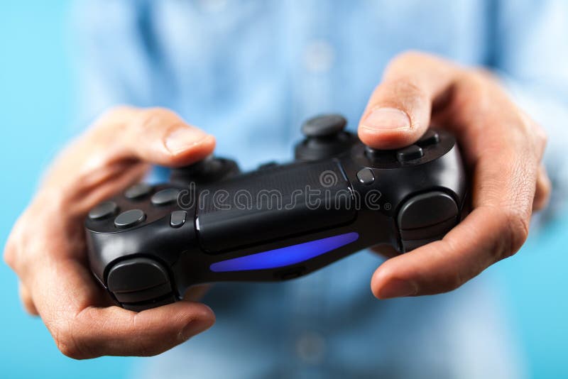 Male Hands Holding a Gaming Controller Stock Image - Image of hand ...