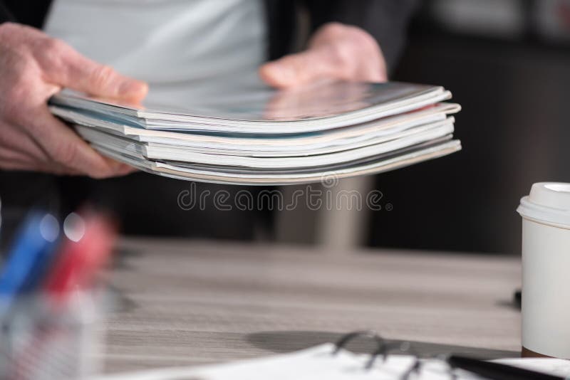 Male Hands Holding Magazines Stock Photo - Image of holding, brochure ...