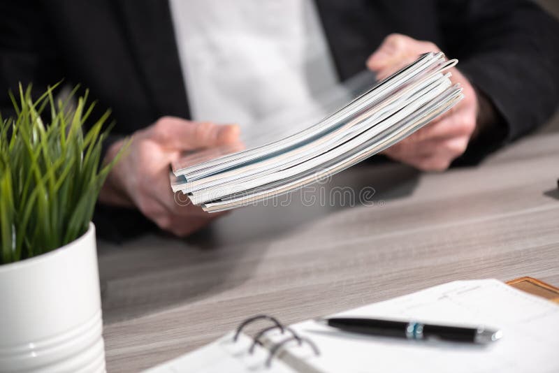 Male Hands Holding Magazines Stock Image - Image of journal, magazine ...