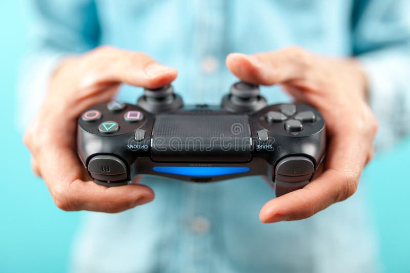 Male Hands Holding a PS4 Controller Editorial Photography - Image of ...