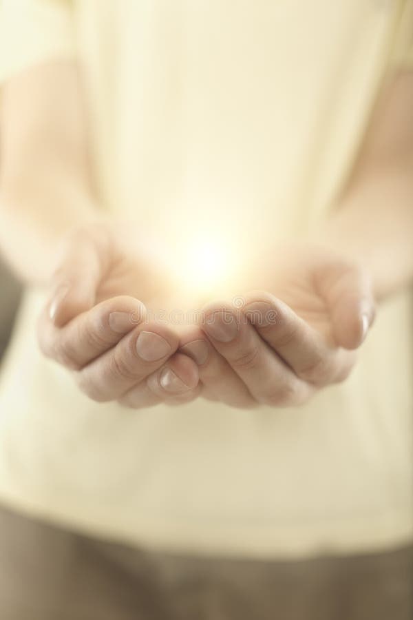 Male Hands Holding Rays of Glowing Light. Stock Image - Image of ...
