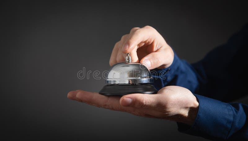 Male Hands Holding Service Bell at Office Stock Photo - Image of ring ...