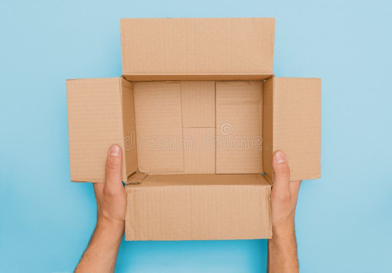 Male Hands Presenting an Opened Carton Package without Content by ...