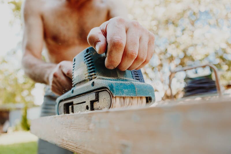 Male Hands are Processing Wood, Grinding Machine. Stock Image - Image ...