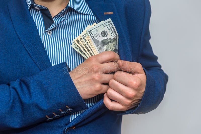 Male Hands Putting Dollar Banknotes into Pocket Stock Image - Image of ...