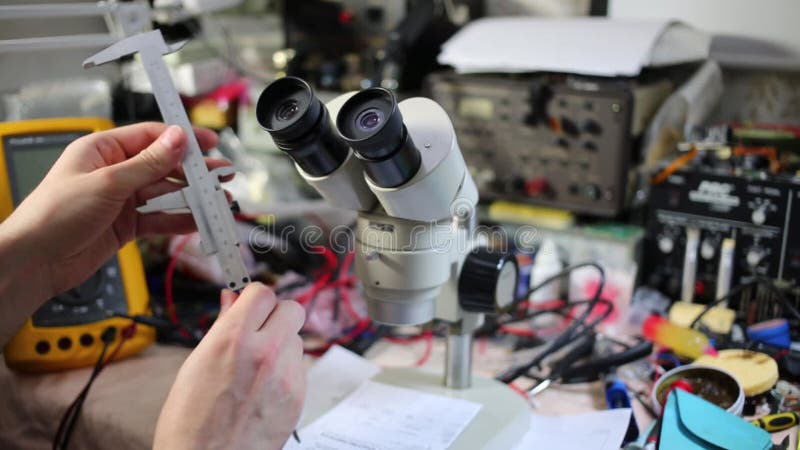 Male Hands with Ruler and Microscope among Many Stock Video - Video of ...