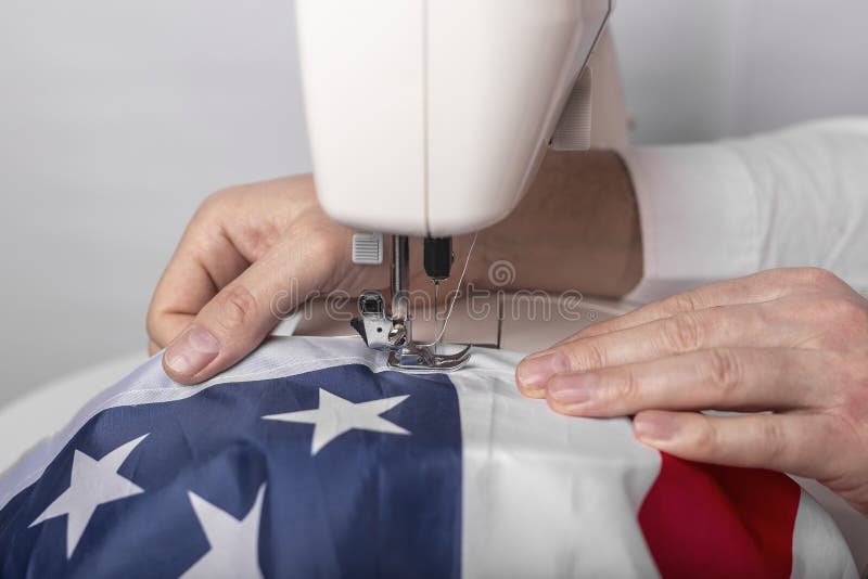 Male Hands Sewing American Flag on Sewing Machine for Us Holiday Stock ...
