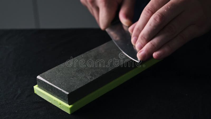 Male Hands Sharpening Kitchen Knife with Whetstone Stock Video - Video ...