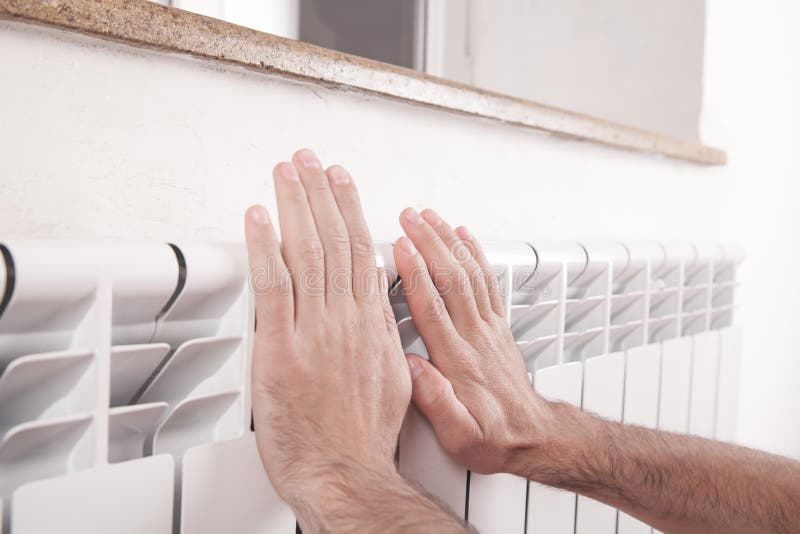 Male Hands Touch a Heating Radiator at Home Stock Image - Image of room ...