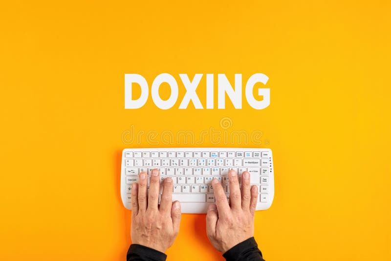 Male Hands Typing the Word Doxing with a Computer Keyboard. Doxing or ...