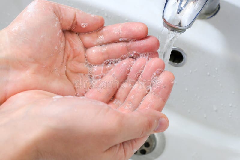 Male Hands Under the Tap with Water Over the Sink in the Bathroom Stock ...