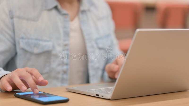 Male Hands Using Smartphone and Typing on Laptop, Close Up Stock Photo ... Male Hands Using Smartphone and Typing on Laptop, Close Up Stock Photo ...