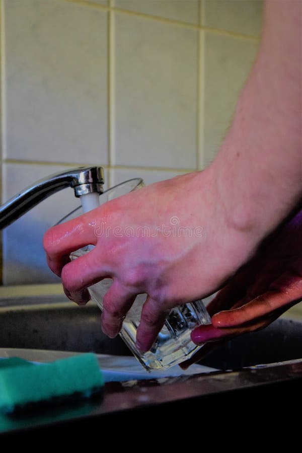 Male hands washing a glass stock photo. Image of water - 114992752
