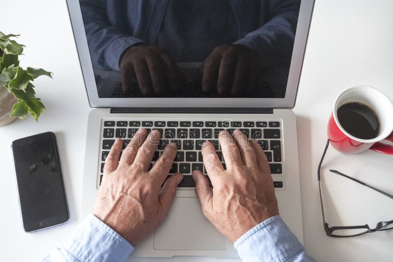Male Hands Working at Home with Laptop Computer - Cell Phone and Coffee ...