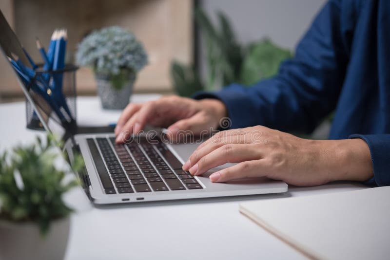 Male Hands Working Using a Laptop Computer on a Desk. Online Internet ...