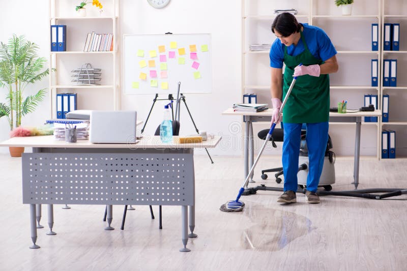 Male Handsome Professional Cleaner Working in the Office Stock Photo ...