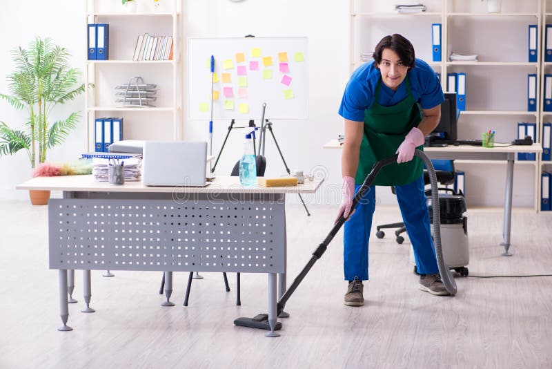 Male Handsome Professional Cleaner Working in the Office Stock Photo ...