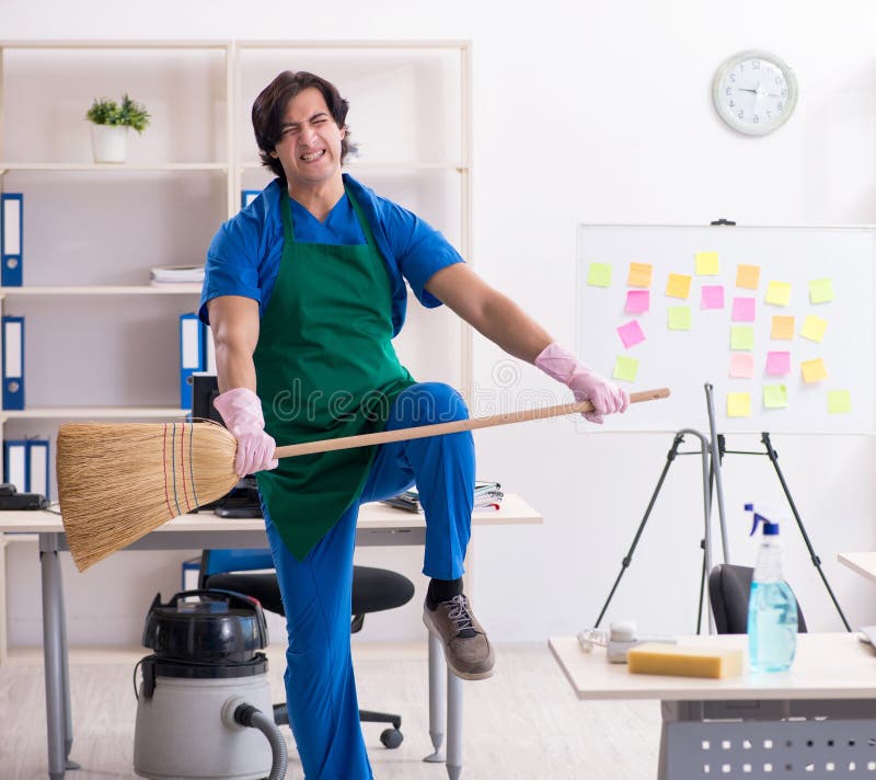 Male Handsome Professional Cleaner Working in the Office Stock Photo ...