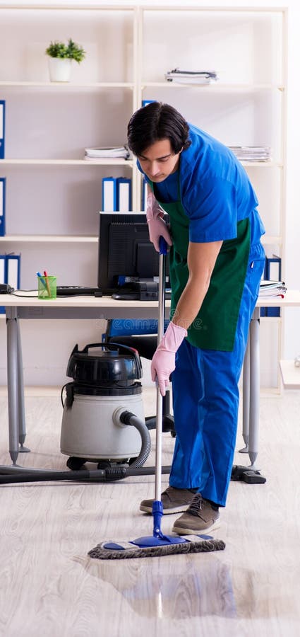 Male Handsome Professional Cleaner Working in the Office Stock Photo ...
