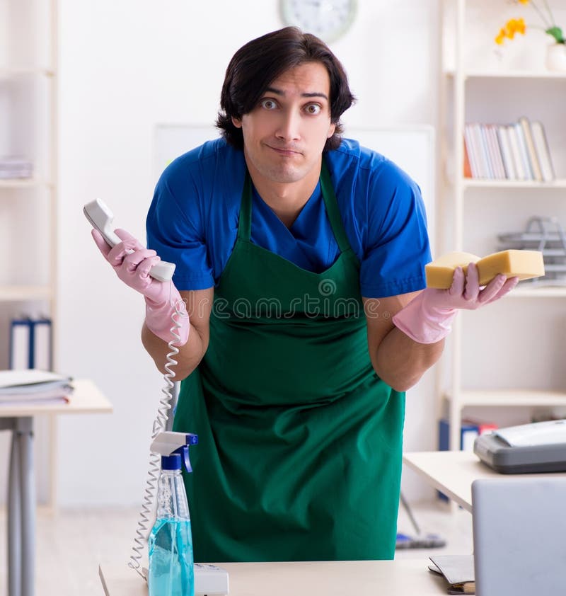 Male Handsome Professional Cleaner Working in the Office Stock Photo ...