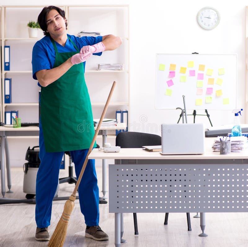 Male Handsome Professional Cleaner Working in the Office Stock Photo ...