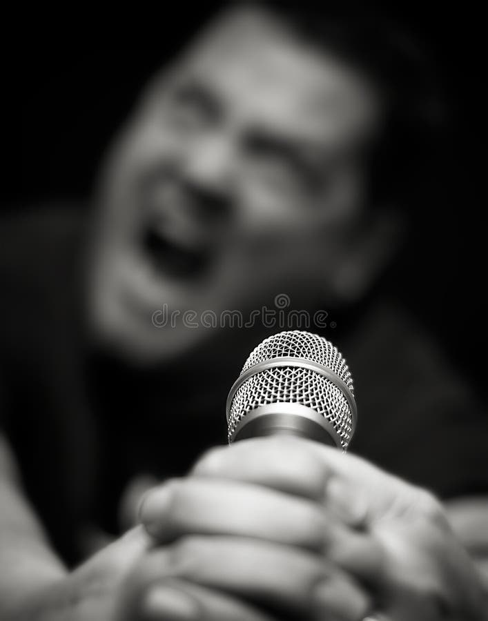 Male Heavy Metal Singer Screams into Microphone Stock Image - Image of ...