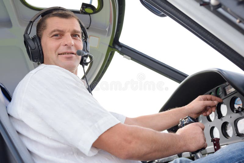 Male on Helicopter Looking at Camera Stock Image - Image of pilot ...