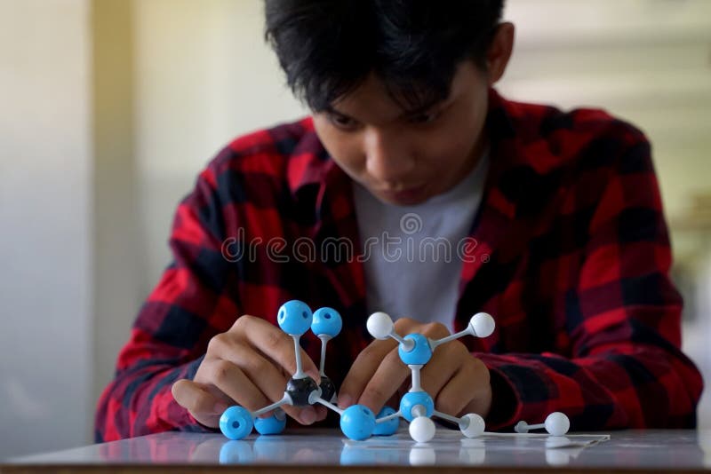 Male High School Student Builds a Shape of Covalent Molecule Model ...