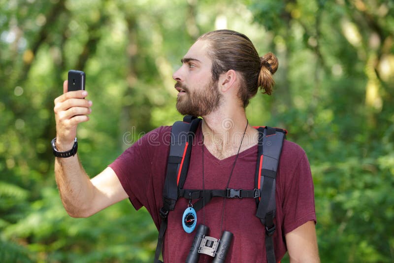 Male Hiker Looking at Phone Stock Photo - Image of travel, adventure ...